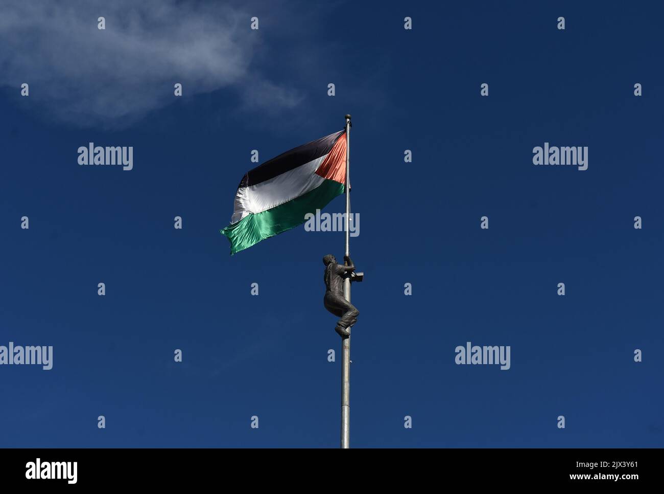 A sculpture of a man climbing a flag pole is seen on Yasser Arafat ...