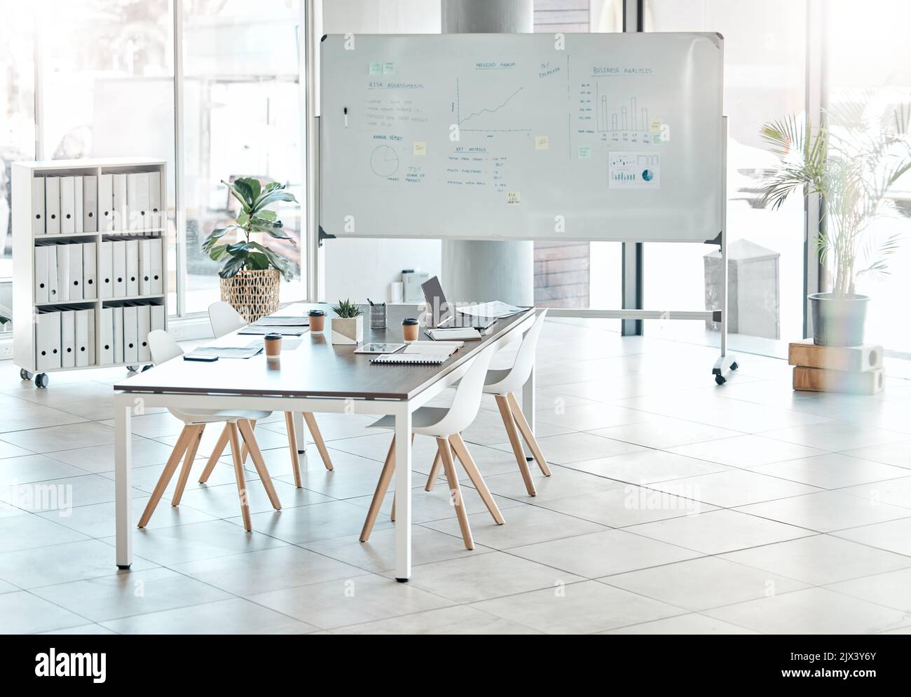 Boardroom, meeting or empty conference room with whiteboard, chairs and ...