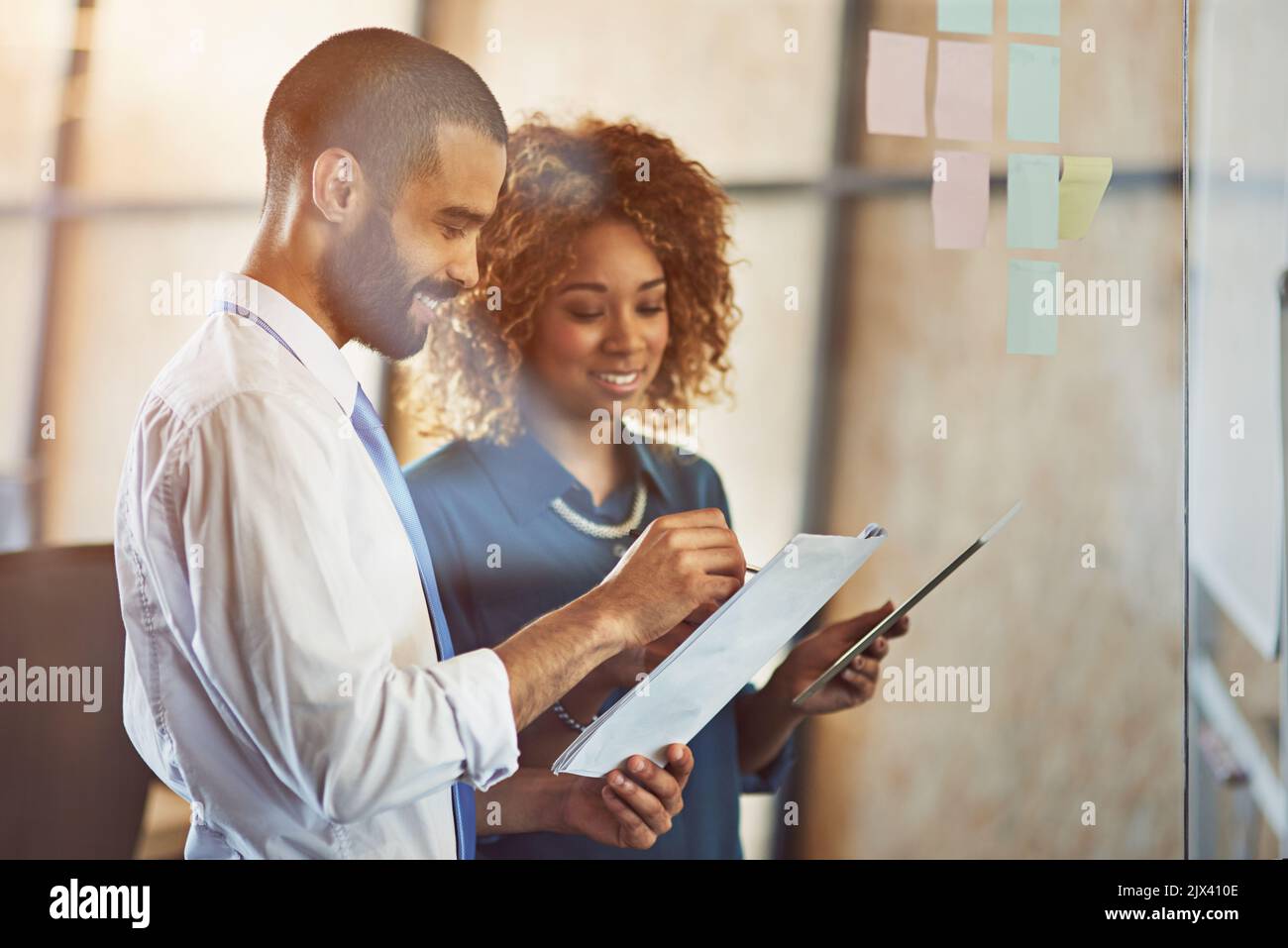 Two business people comparing notes hi-res stock photography and images ...