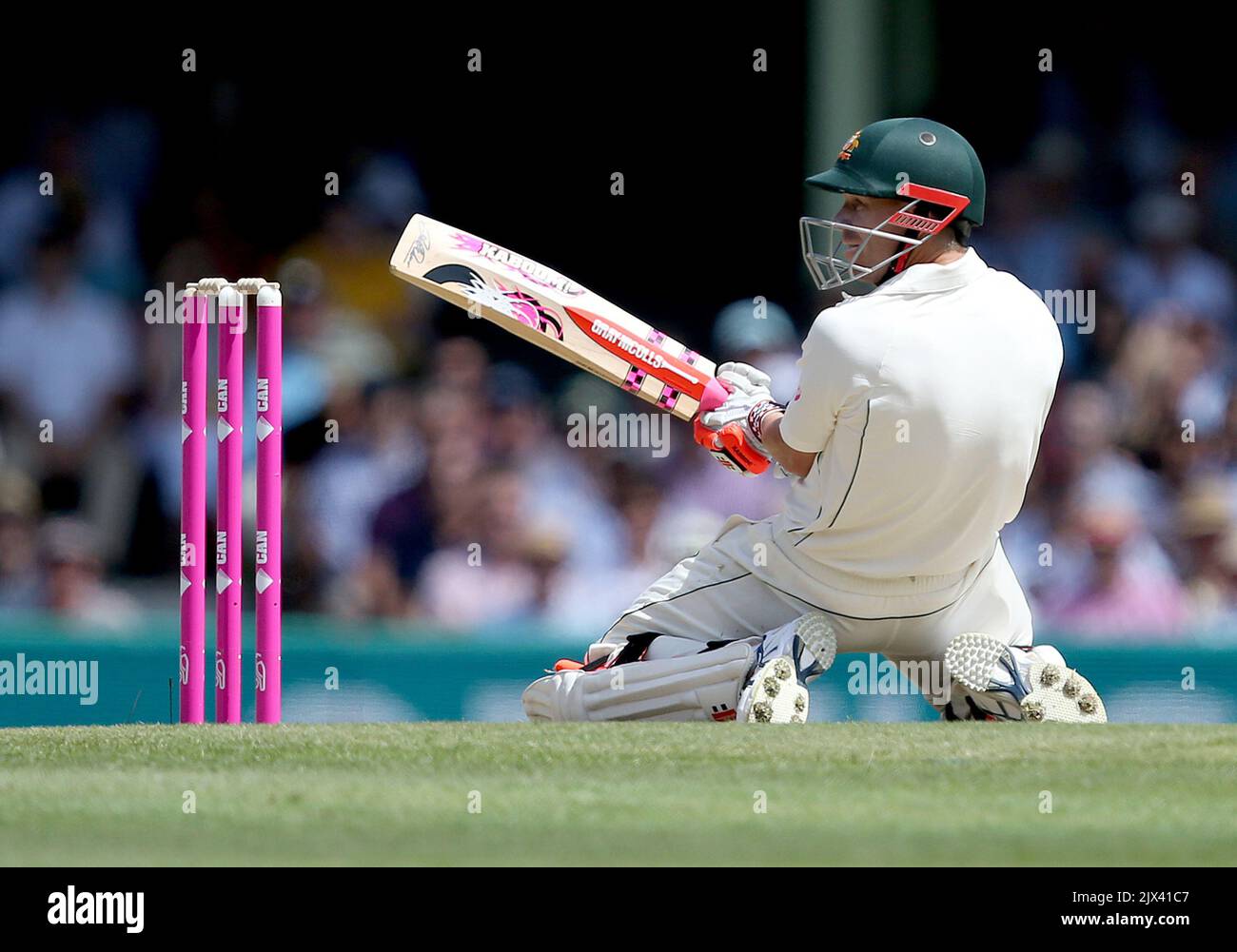 David Warner (centre) of Australia drops to his knees to avoid a ...