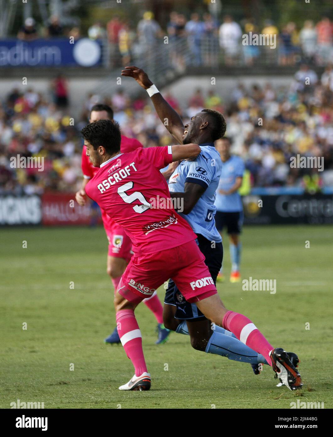 Harry Ascroft of the Mariners fouls Bernie Ibini of Sydney FC during ...