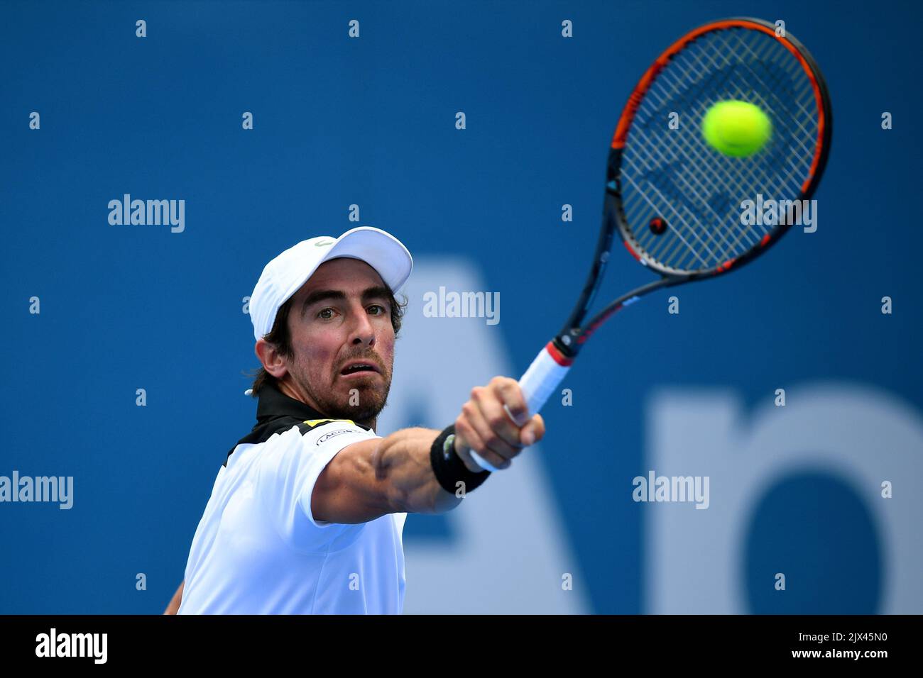 Pablo Cuevas of Uruguay plays a return shot to Gilles Muller of ...