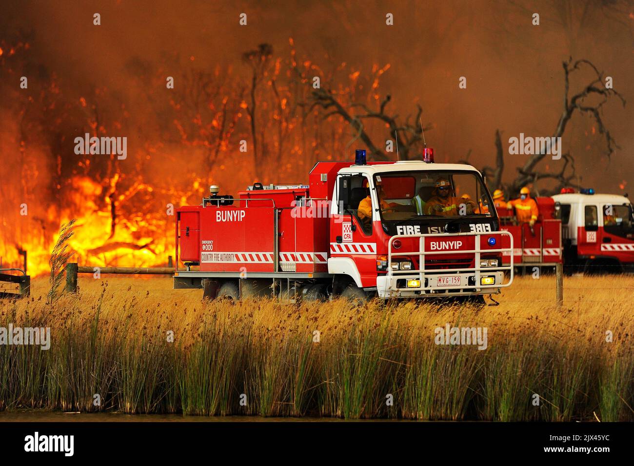 Fire fighters battle bushfires burning at the Bunyip State Forest near ...