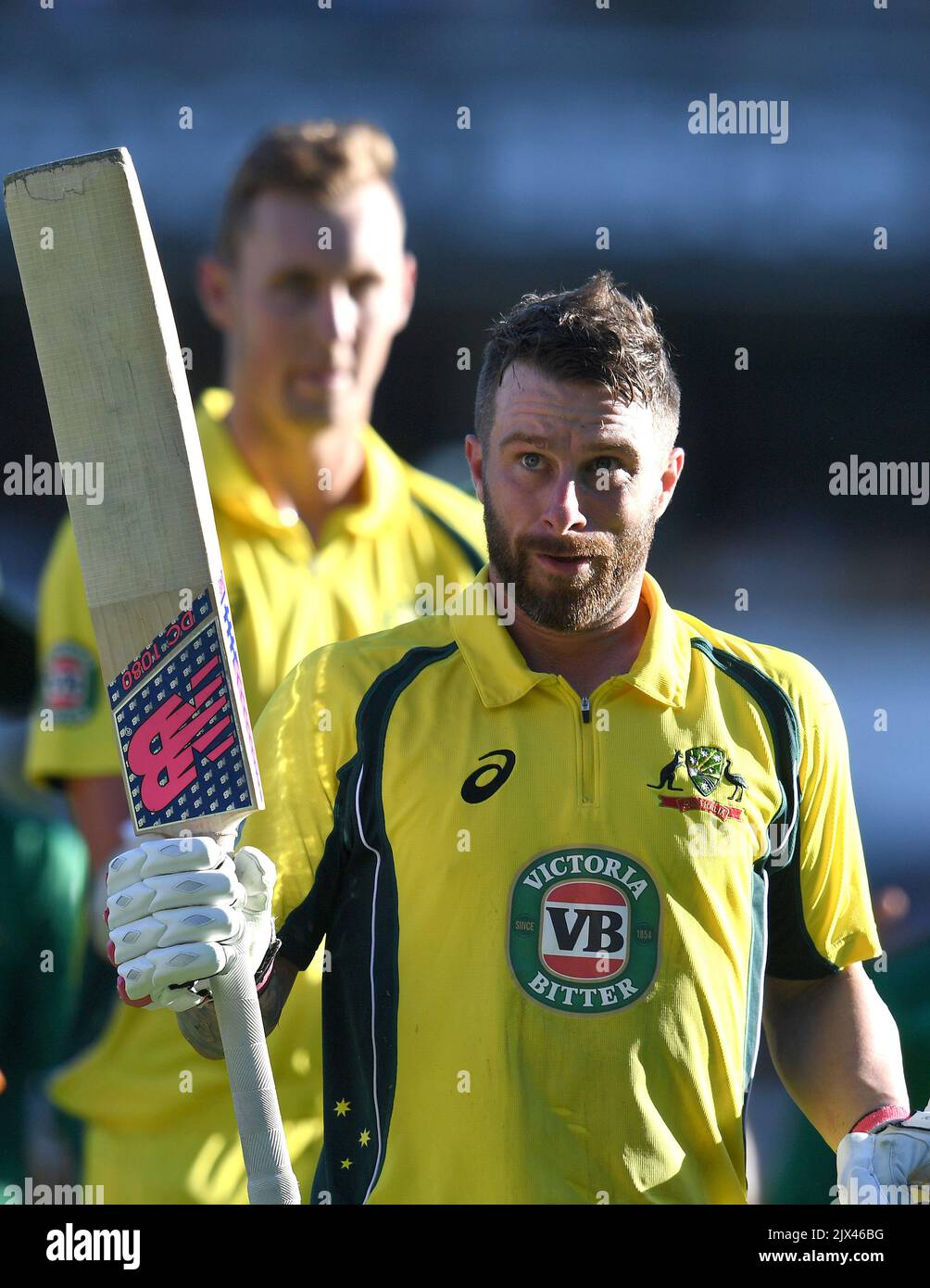 Australian batsman Matthew Wade celebrates after scoring a century ...