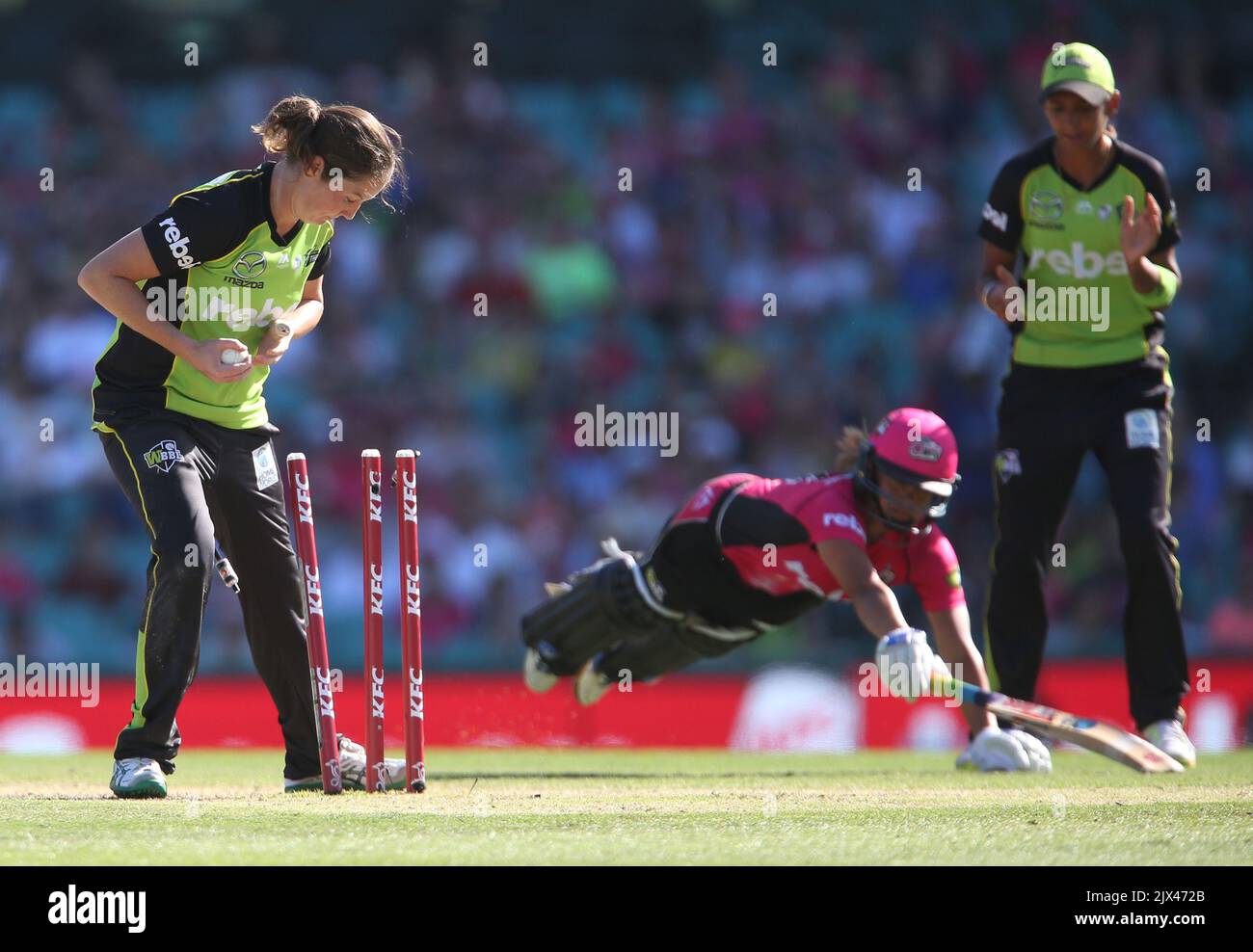 Angela Reakes of the Sixers run out by Erin Osborne of the Thunder in ...