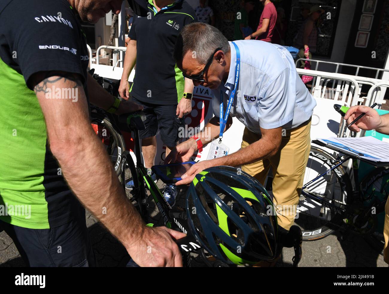 A UCI official checks a competitor's bike for mechanical doping during ...