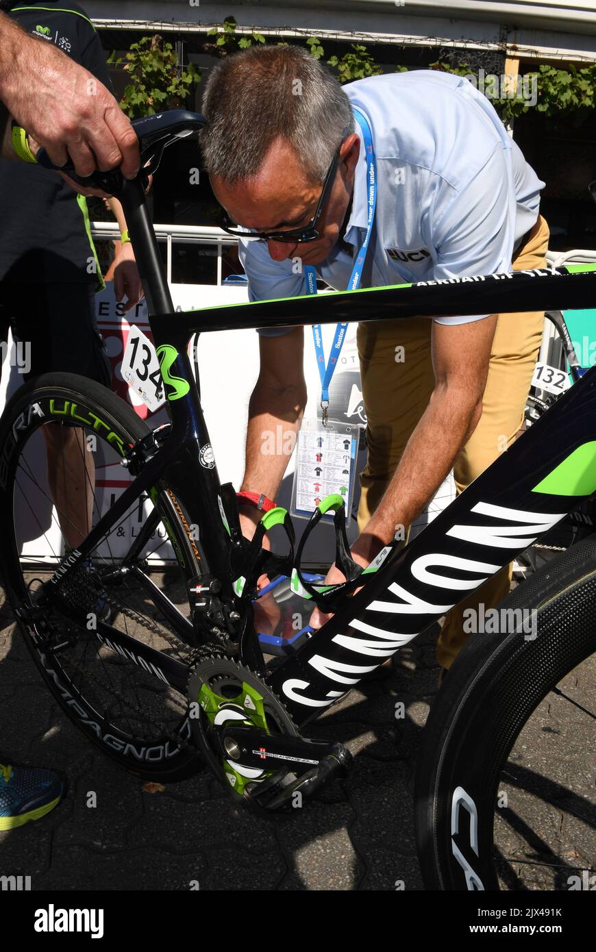 A UCI official checks a competitor's bike for mechanical doping during ...