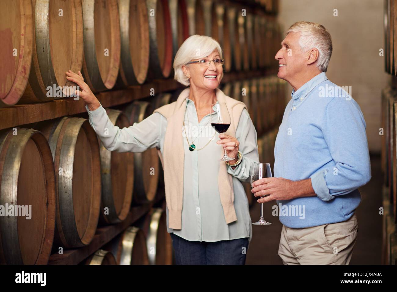 This is a great batch. an affectionate senior couple wine tasting in a ...
