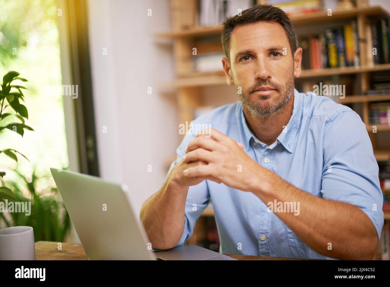 Success always comes with hard work. a young man working from home ...