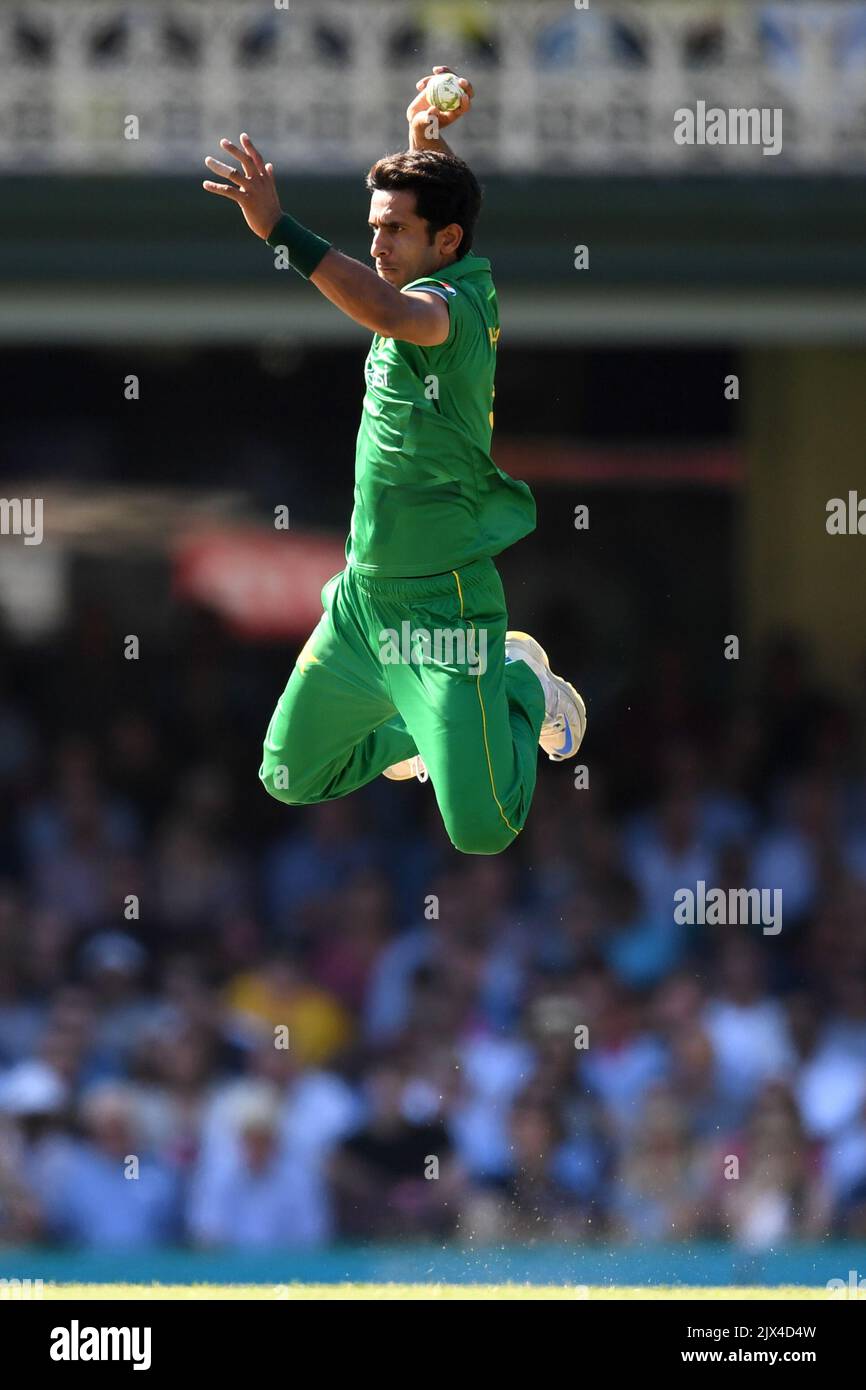Hassan Ali of Pakistan fields a ball hit by Glen Maxwell of Australia ...