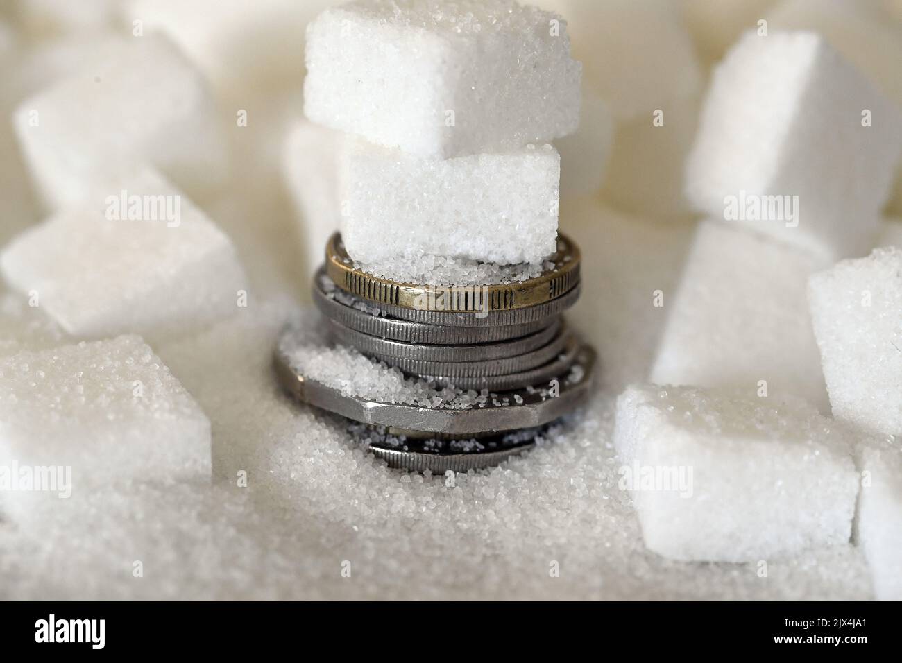 A generic image of a Australian coins sitting in amongst sugar cubes ...