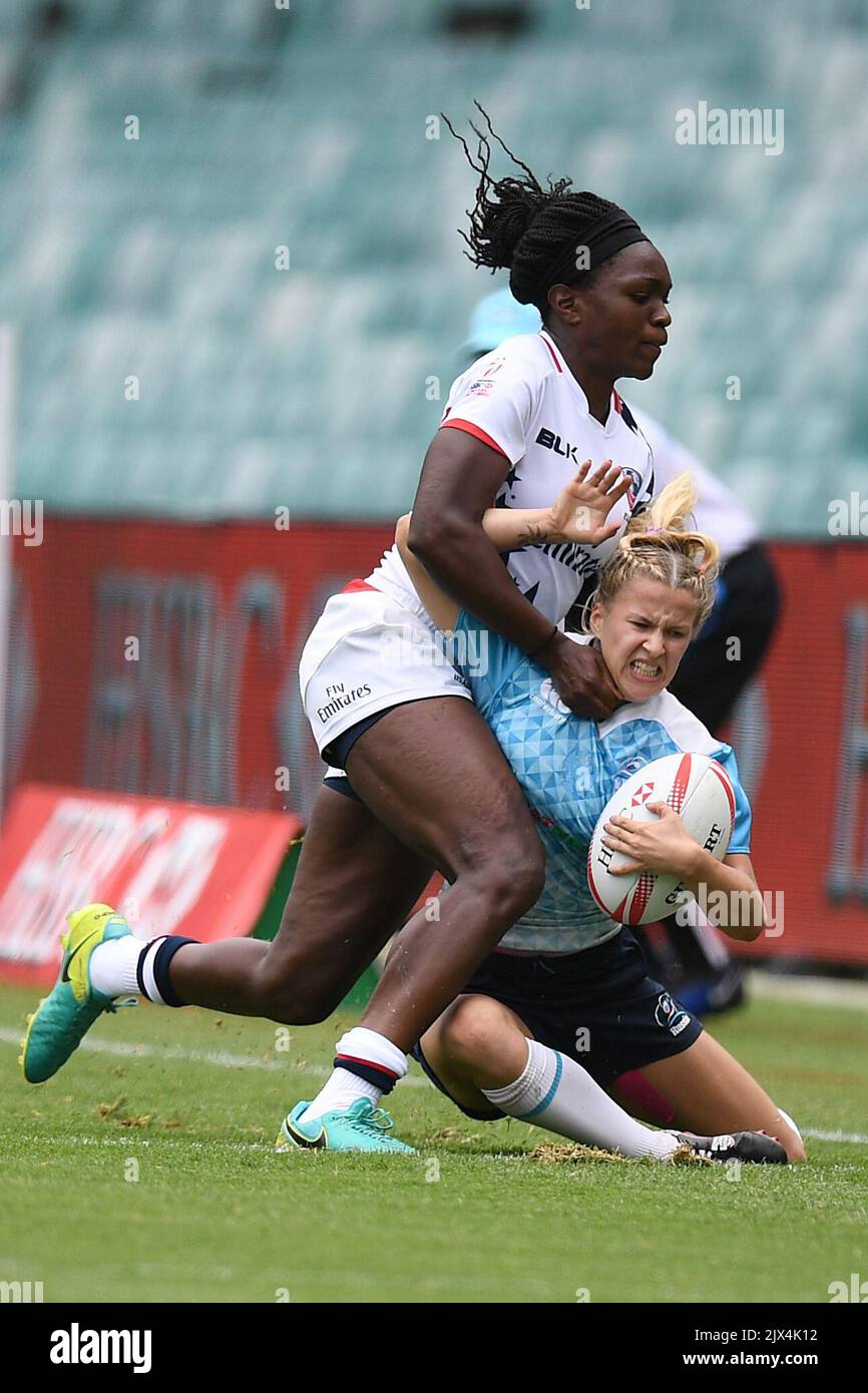 Alena Mikhaltsova of Russia is tackled by Cheta Emba of the USA during ...