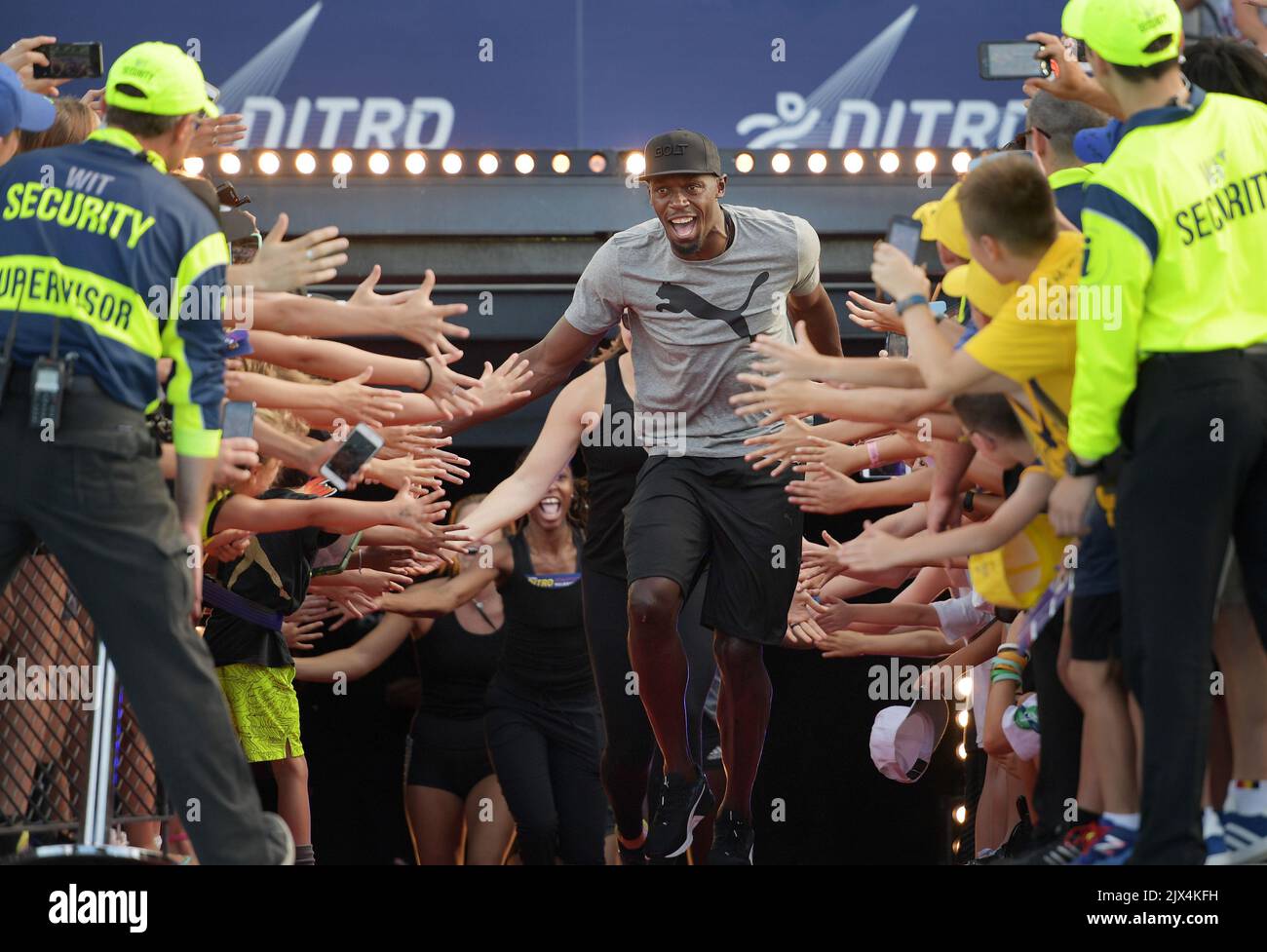 Jamaican sprinter Usain Bolt runs onto the field at the start of the ...