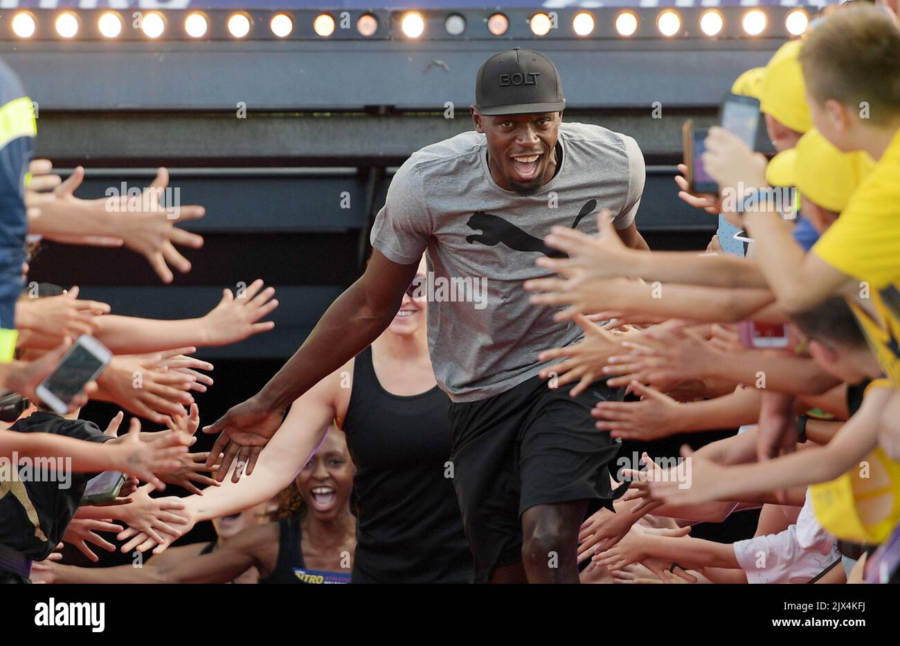 Jamaican sprinter Usain Bolt runs onto the field at the start of the ...