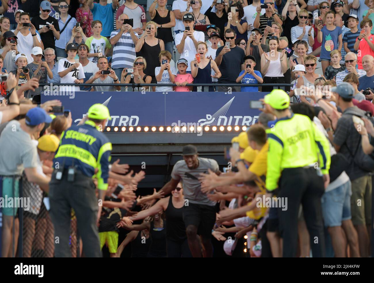 Jamaican sprinter Usain Bolt runs onto the field at the start of the ...
