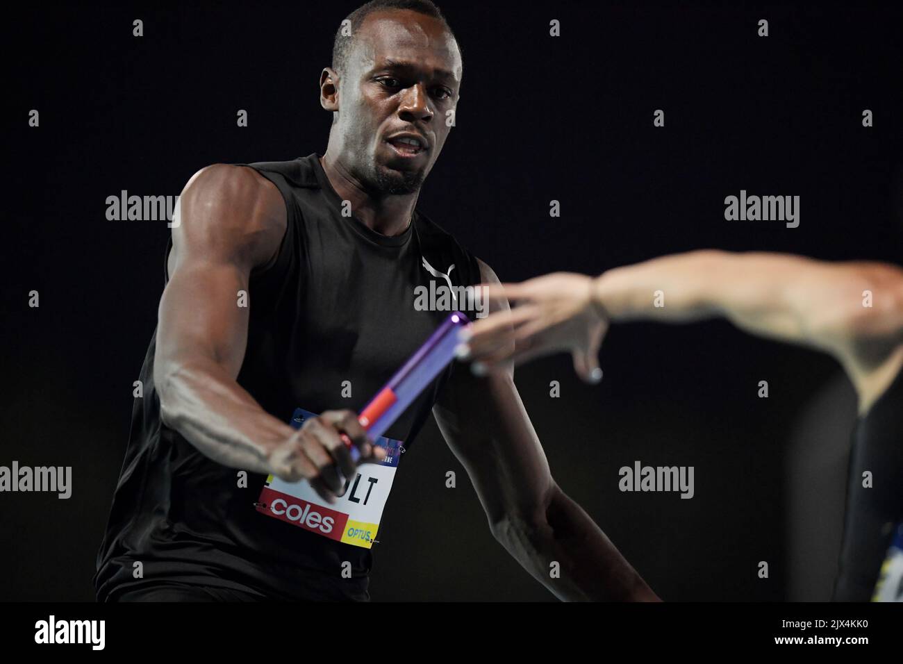 Jamaican sprinter Usain Bolt passes the button to Jenna Prandini of the ...