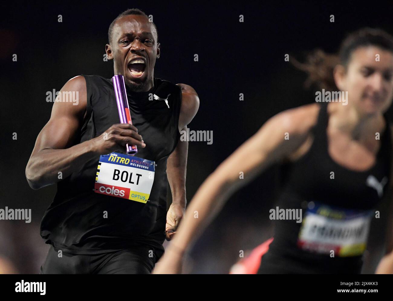 Jamaican sprinter Usain Bolt passes the button to Jenna Prandini of the ...