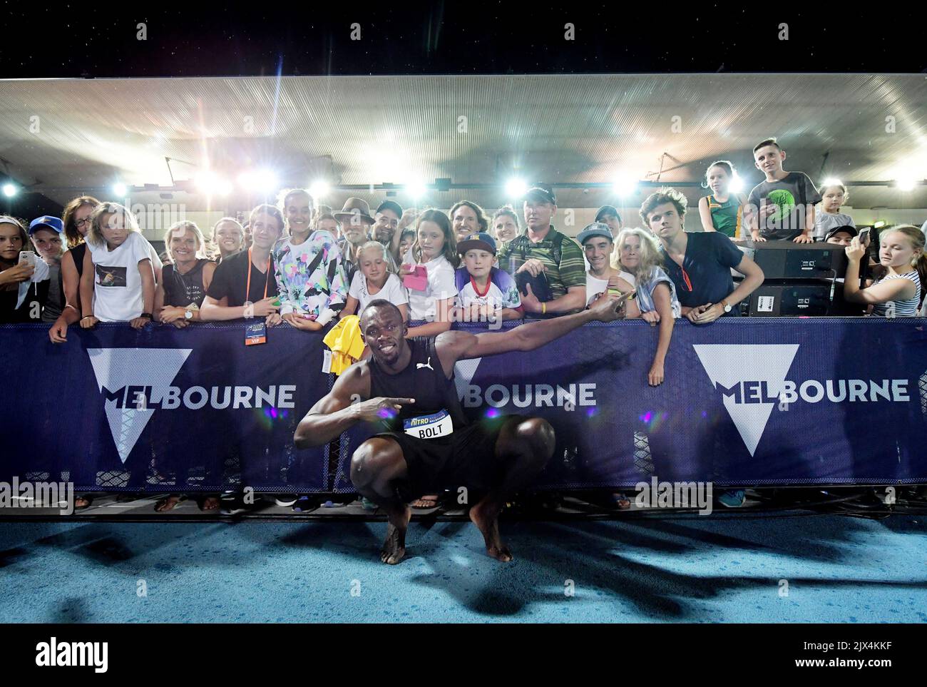 Jamaican sprinter Usain Bolt poses for photographs with fans after the ...