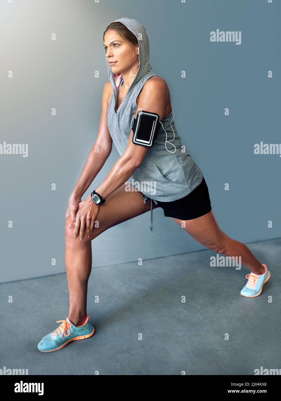 Make your muscles work for you. a fit young woman lunging during her ...