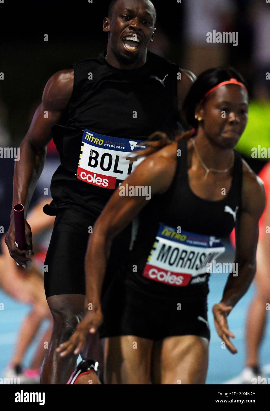 Jamaican sprinter Usain Bolt passes the button to Jenna Prandini in the ...