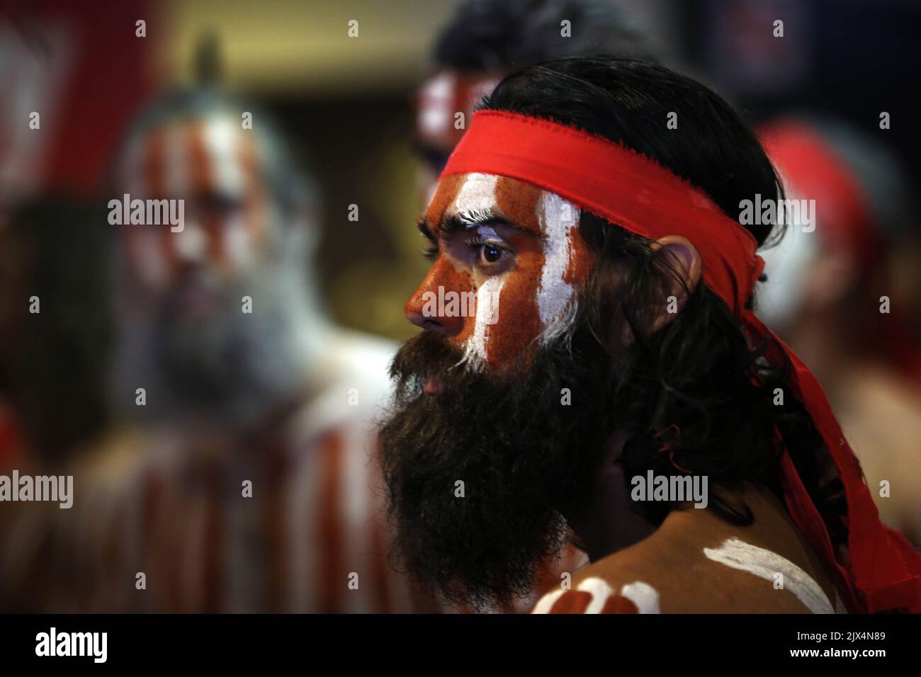An indigenous dancer prepares to perform before the NRL Indigenous All ...