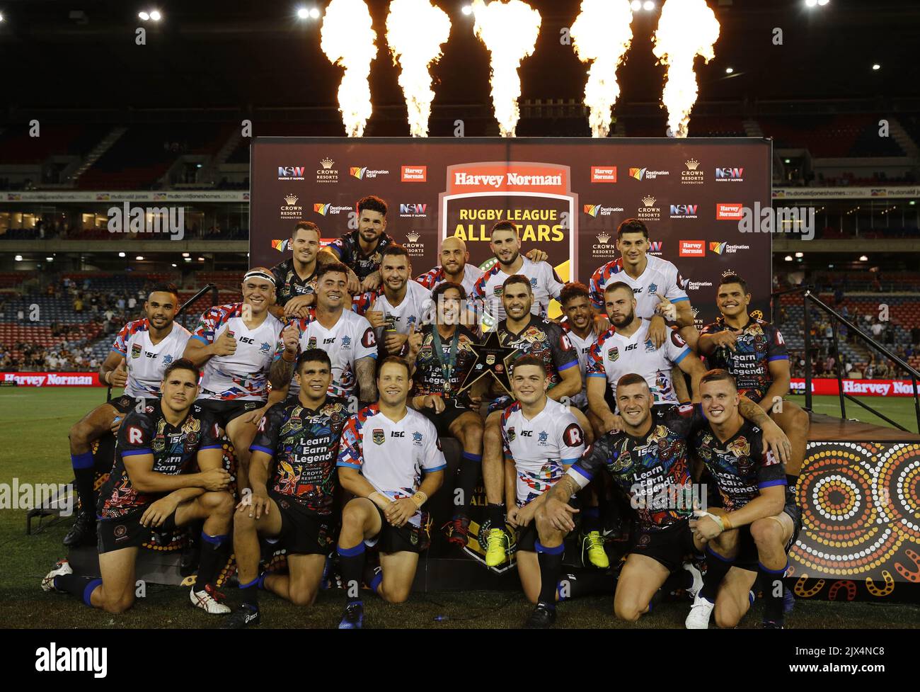 The Indigenous All Stars team celebrate with the Arthur Beetson trophy ...