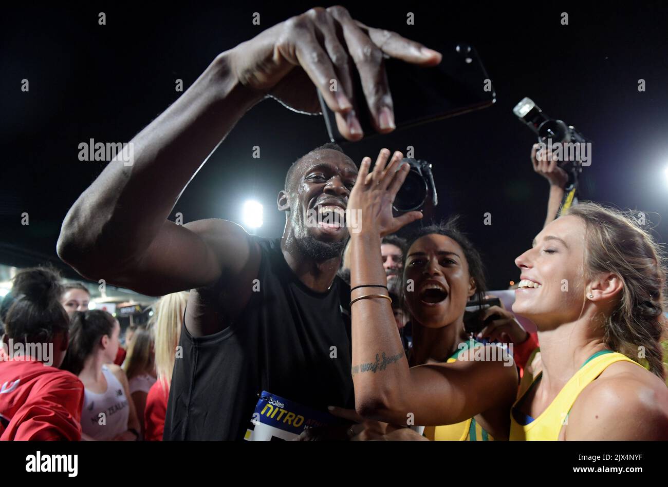 Jamaican sprinter Usain Bolt with Australian athlete Morgan Mitchell ...