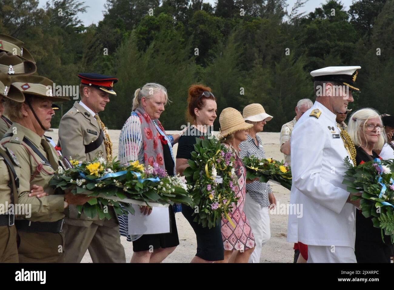 Family members lay wreaths during the first official Bangka ceremony on ...