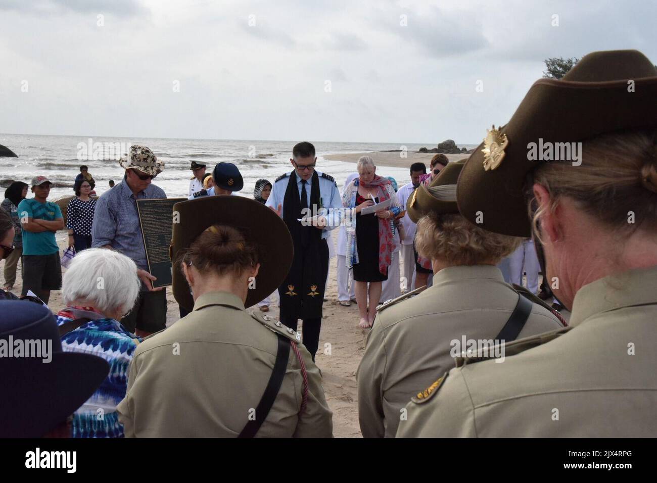 Family members and Australian army nurses during a service of the first official Bangka ceremony ...
