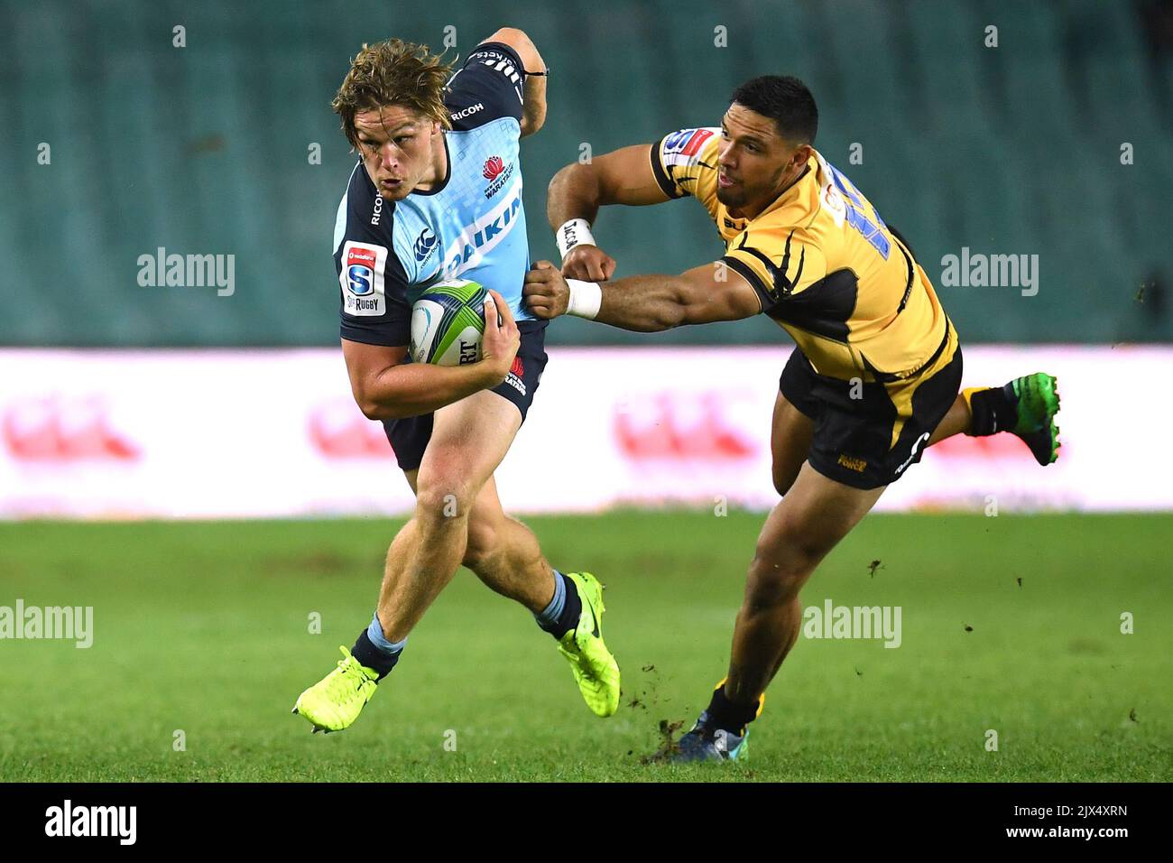Michael Hooper the Waratahs evades a tackle by Curtis Rona of the Force ...