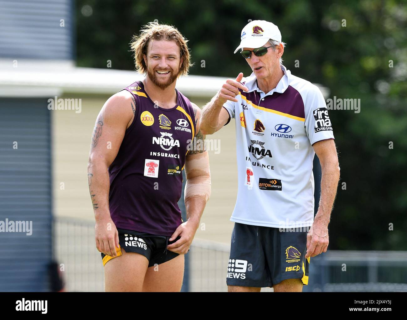 Korbin Sims (left) and coach Wayne Bennett look on during the Brisbane ...