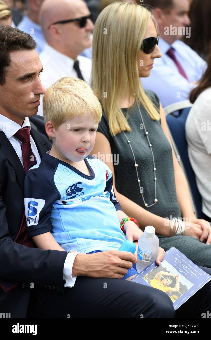 Dan Vickerman's son, Xavier, attends a public memorial service for his ...