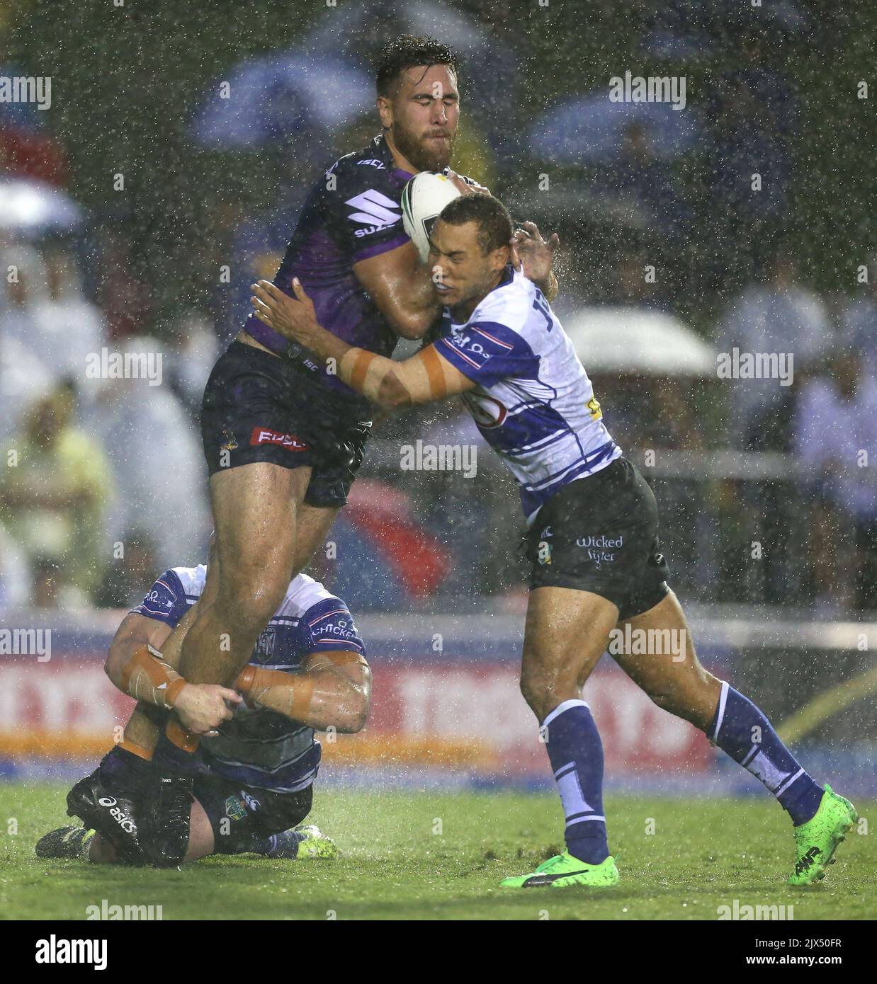 Moses Mbye of the Bulldogs tackles Nelson Asofa-Solomona during the ...