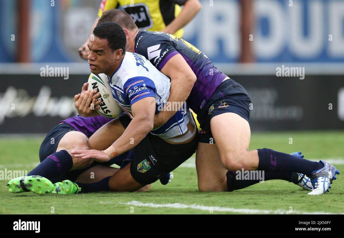 Will Hopoate of the Bulldogs is tackled during the Round 1 NRL match ...