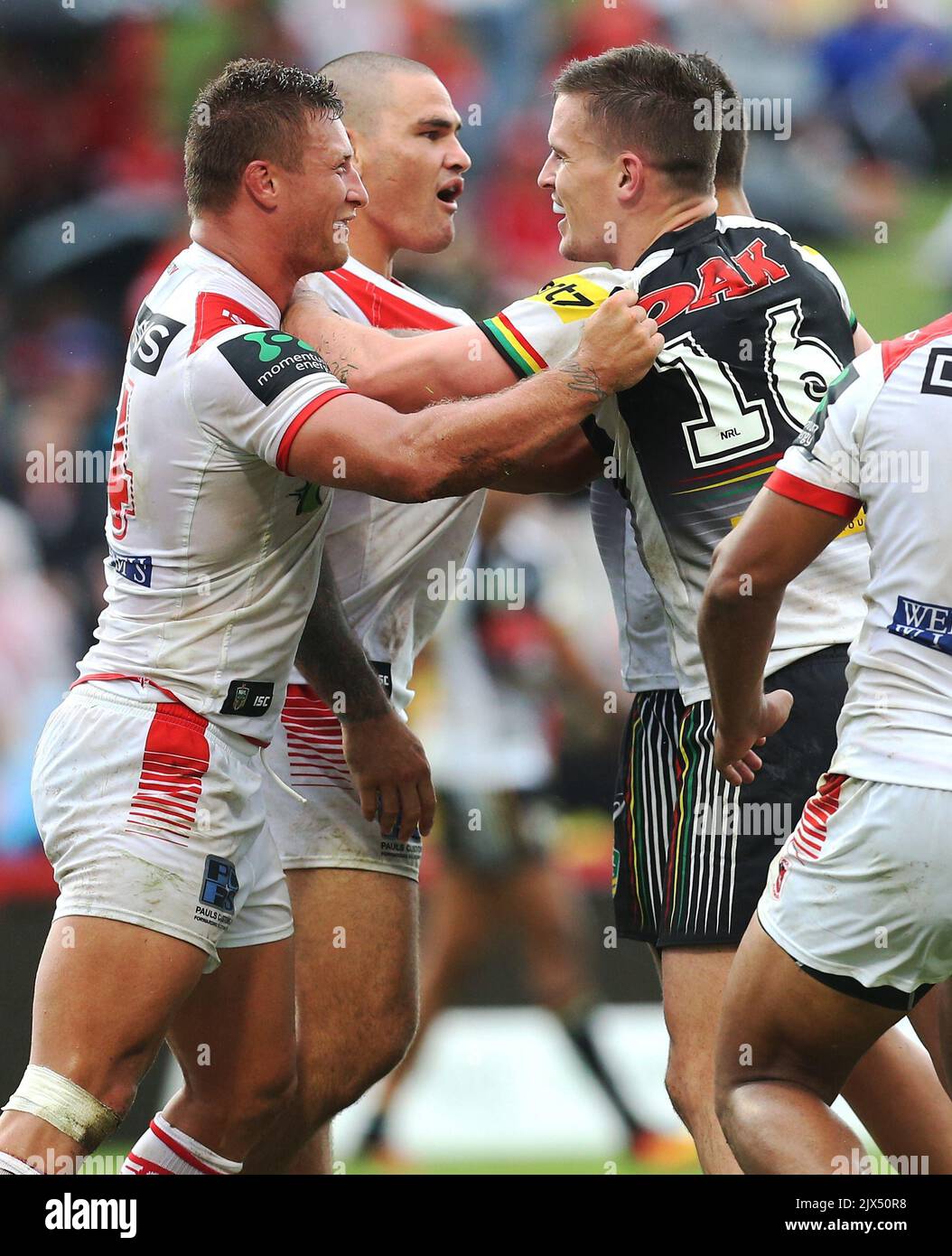 Tariq Sims of the Dragons and Timothy Browne of the Panthers grapple ...