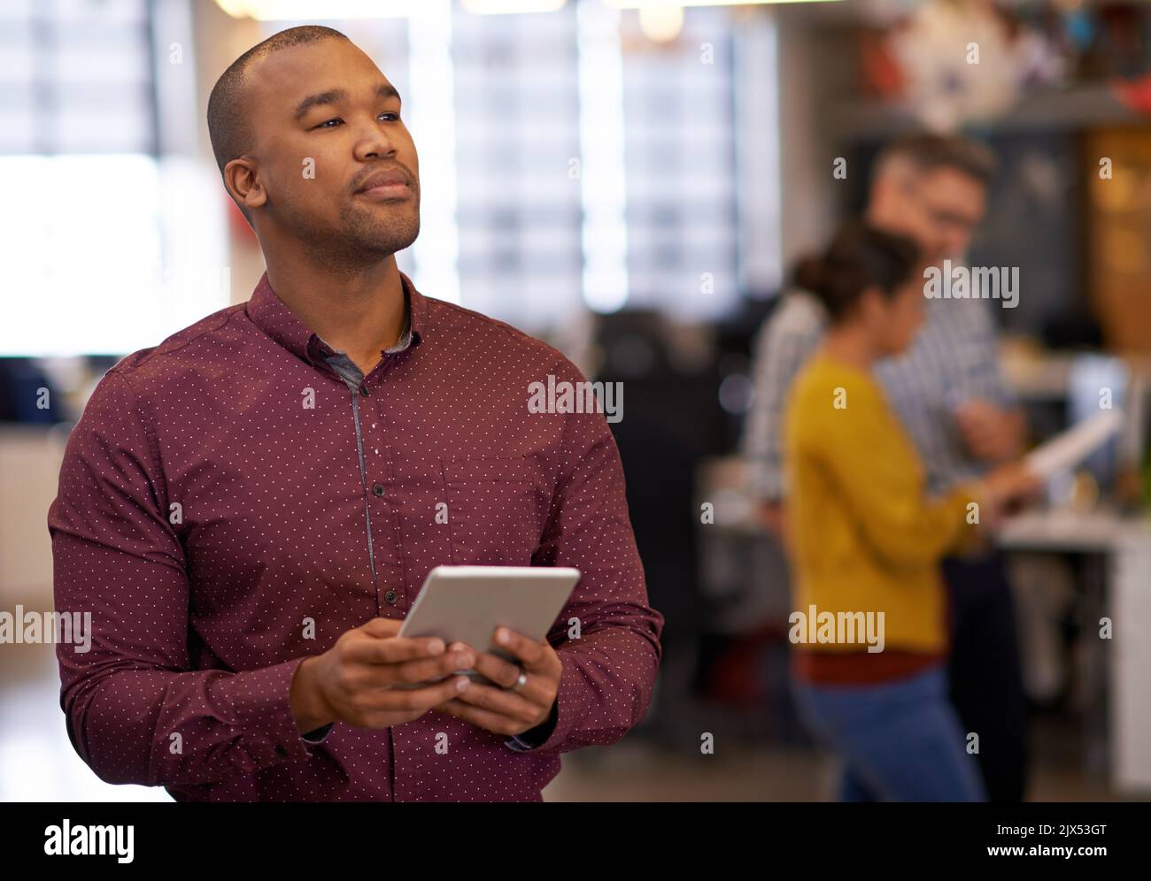 Waiting for inspiration to strike. an office worker looking thoughtful ...