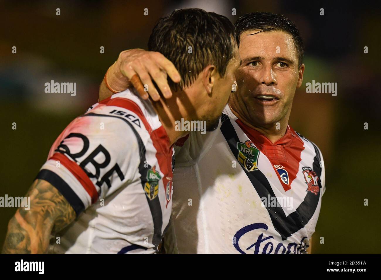 Michael Gordon of the Roosters celebrates his try with Mitchell Pearce ...