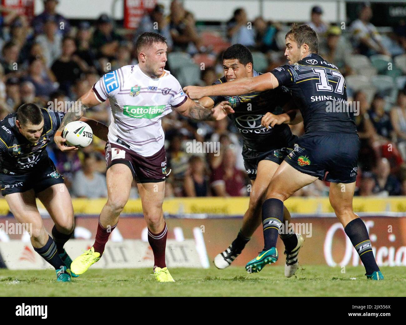 Sea Eagles Curtis Sironen looks to fend off the Cowboys defenders, from ...