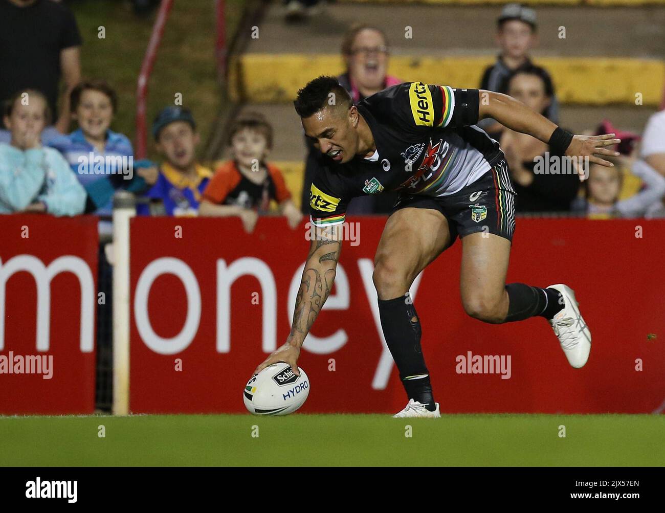 Dean Whare of the Panthers scores and celebrates with Nathan Cleary and ...
