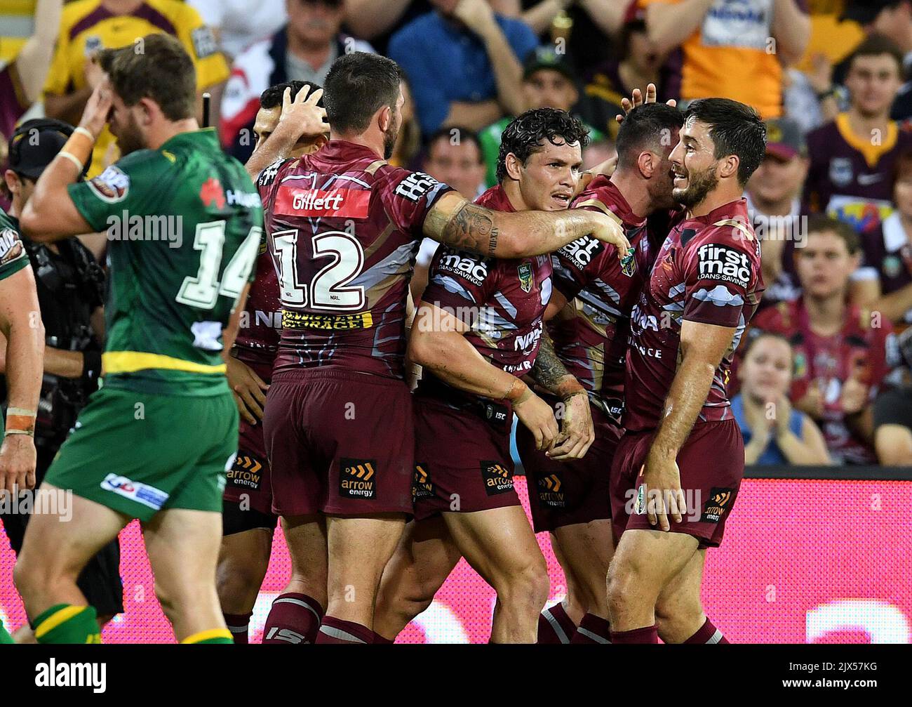 Brisbane Broncos players celebrate a try against the Canberra Raiders ...