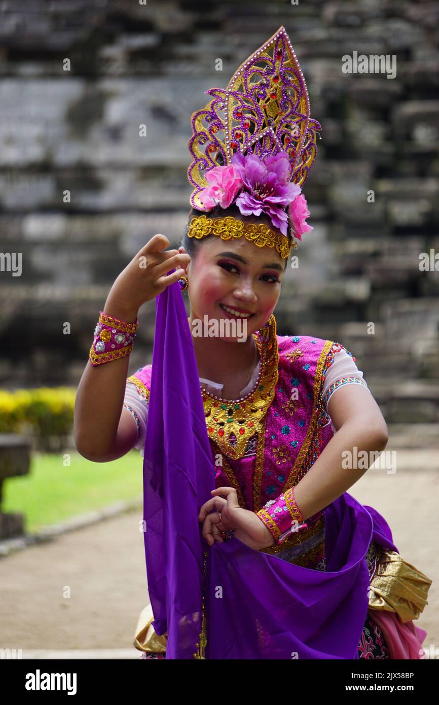 Indonesian dancers with traditional costumes are ready to perform to ...
