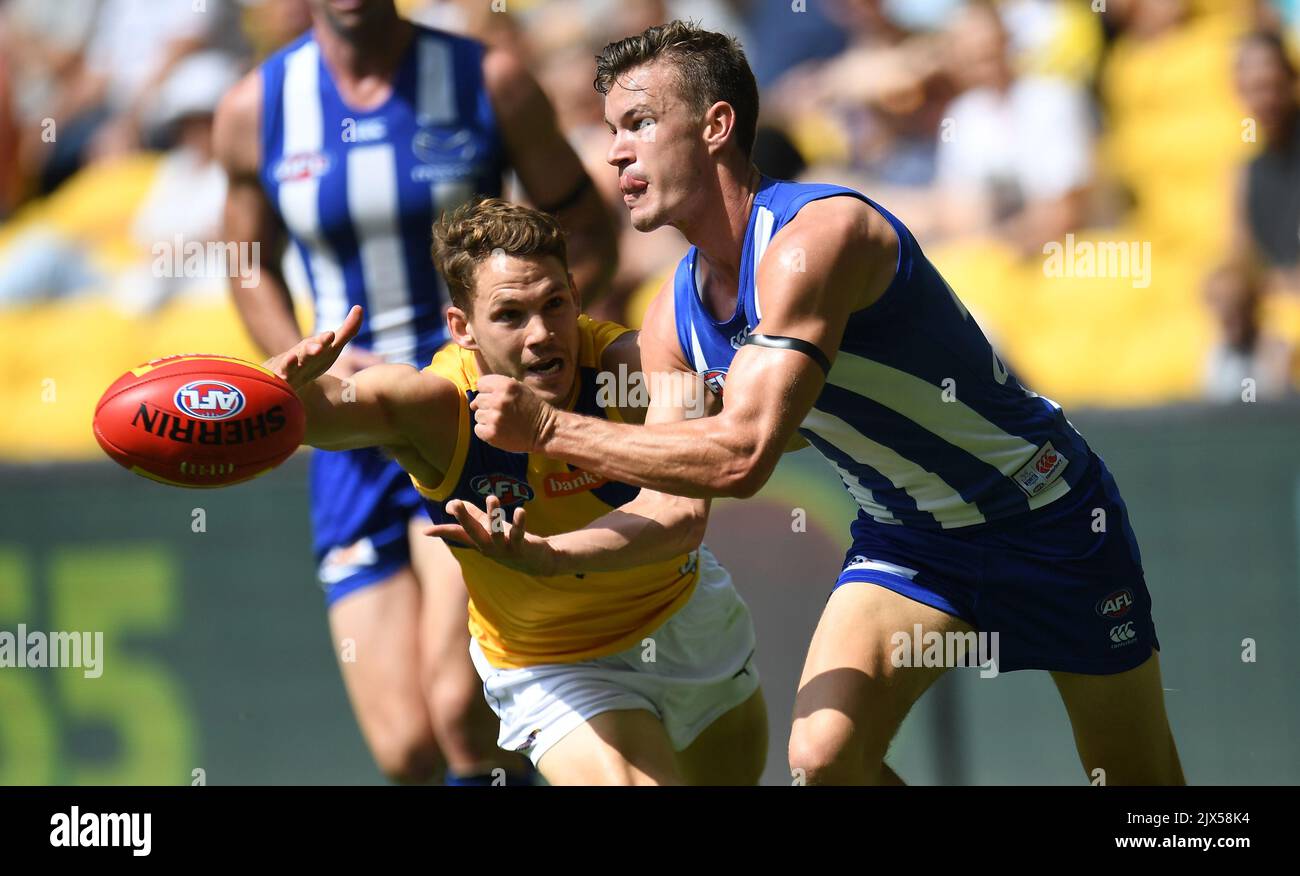 Kayne Turner (right) of the Kangaroos is seen in action during the ...