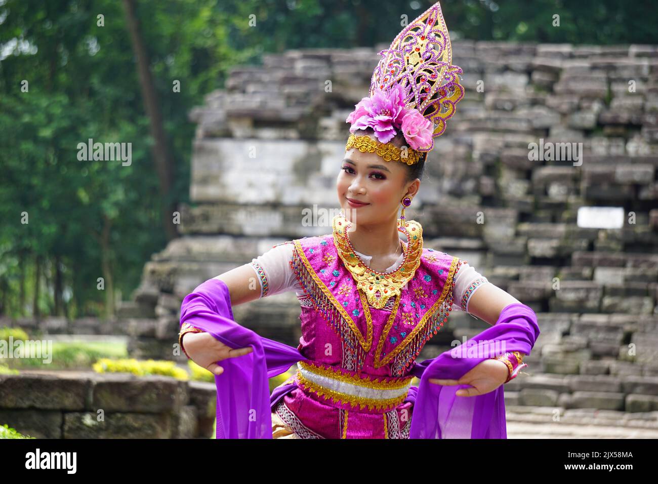 Indonesian dancers with traditional costumes are ready to perform to ...