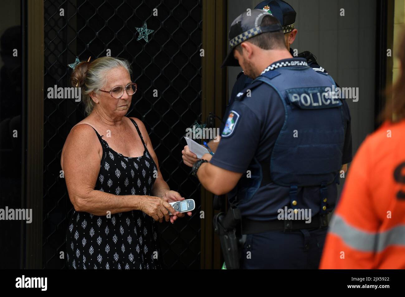 Jan Bridges (left) advising police officers that she will not evacuate ...
