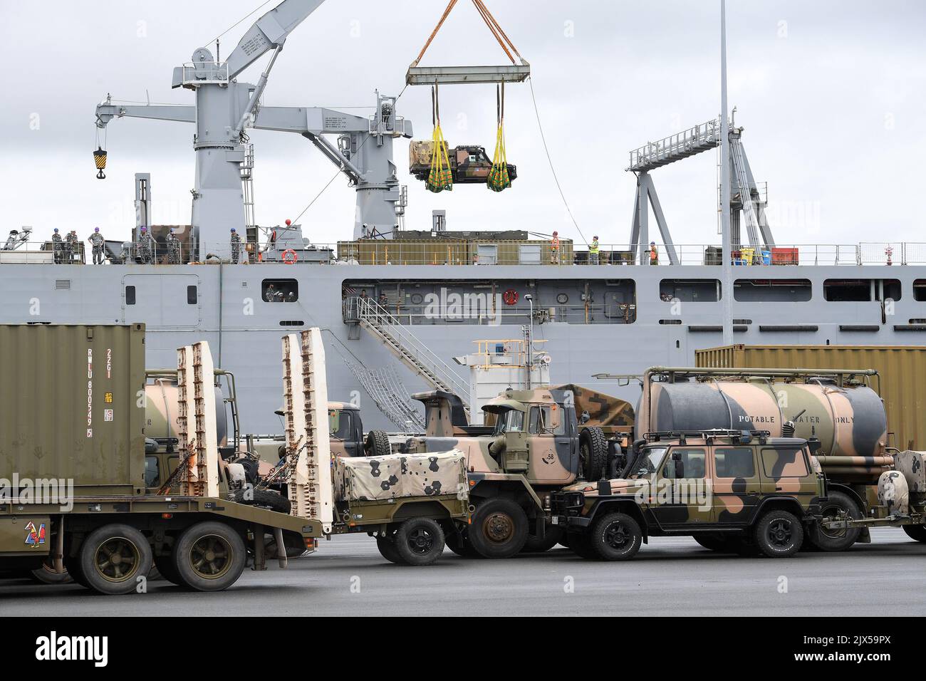 Emergency relief supplies are loaded onto the Royal Australian Navy ...