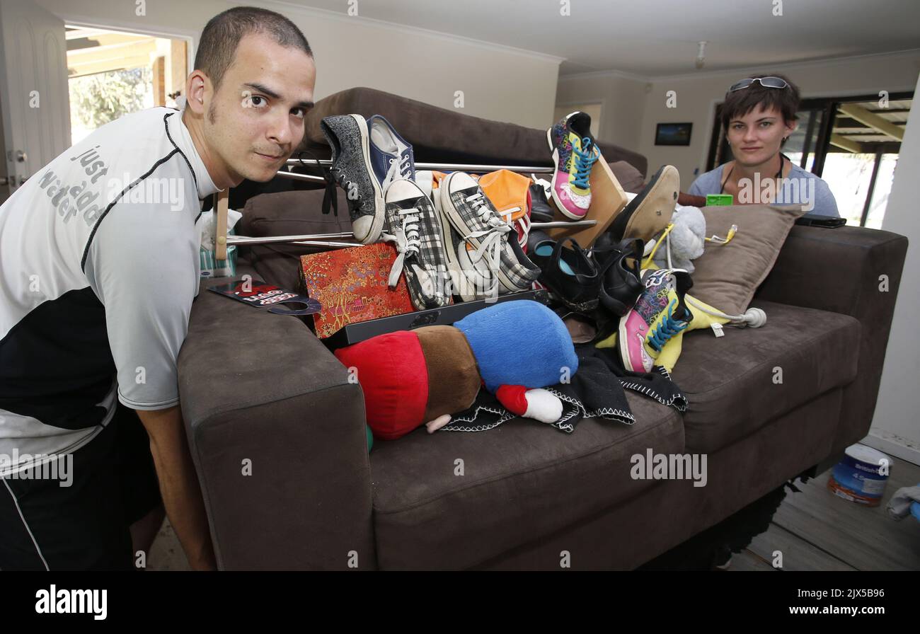Adam McGrogan and Ashleigh McGrogan remove their belongings from house ...