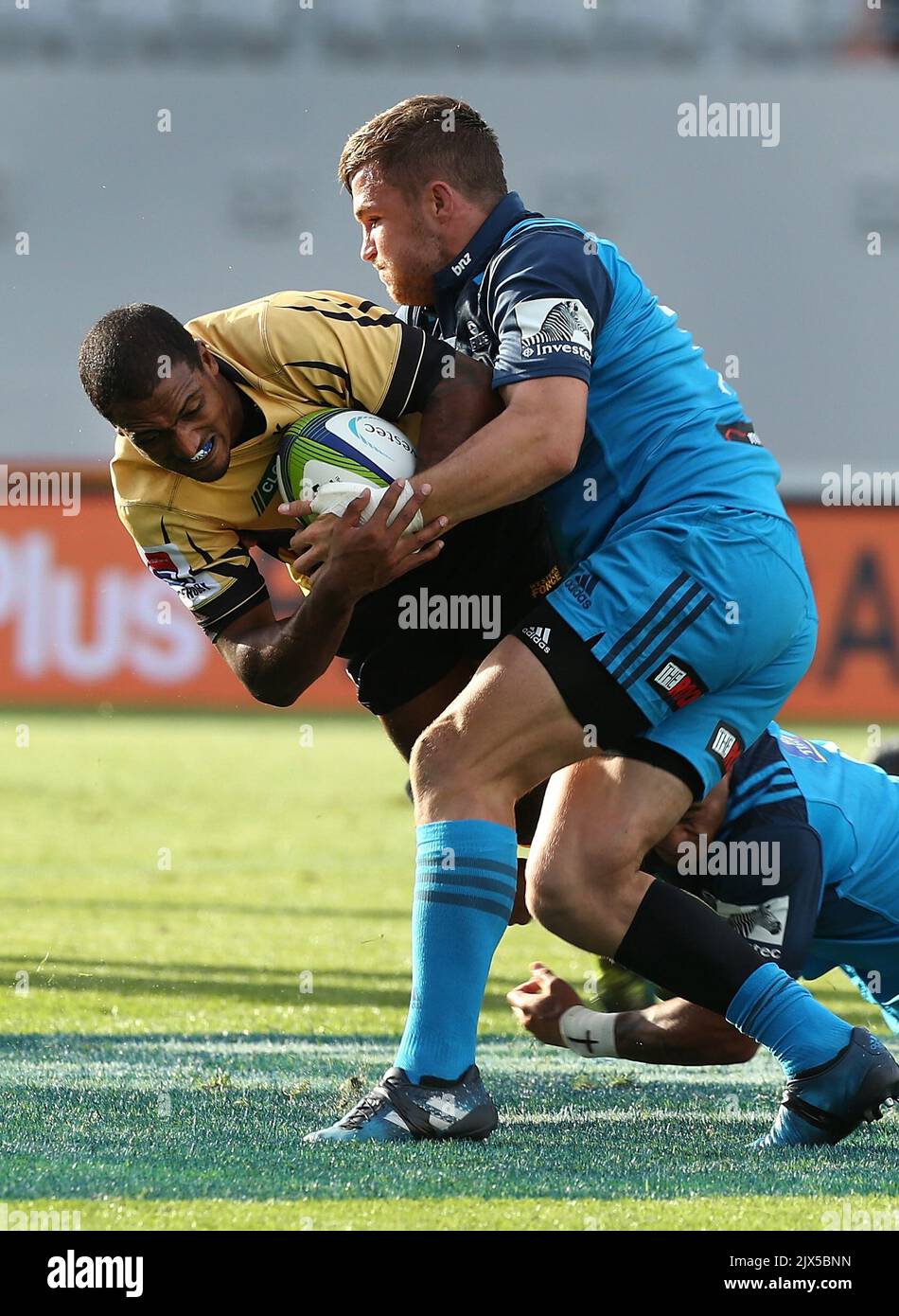 Michael Collins of the Blues tackles Marcel Brache of the Force during ...