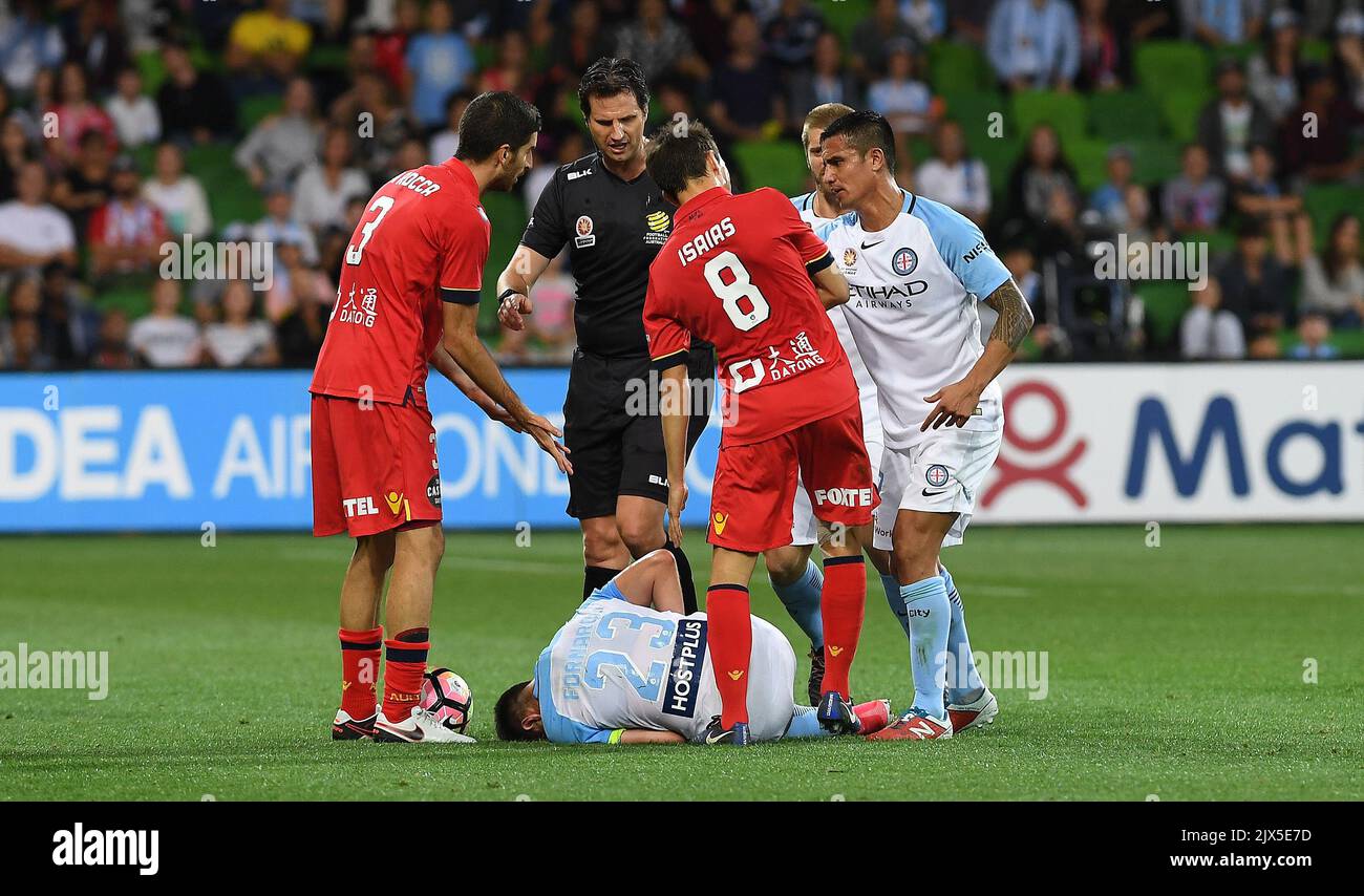 United player Isaias (fourth from left) and City player Tim Cahill are ...