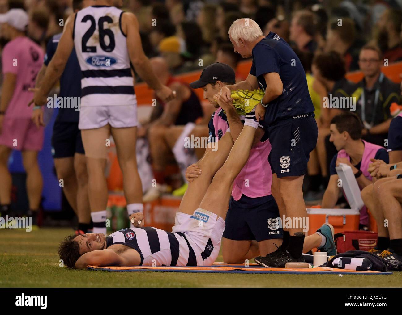 Daniel Menzel of the Cats lands has his legs worked on, on the boundary ...