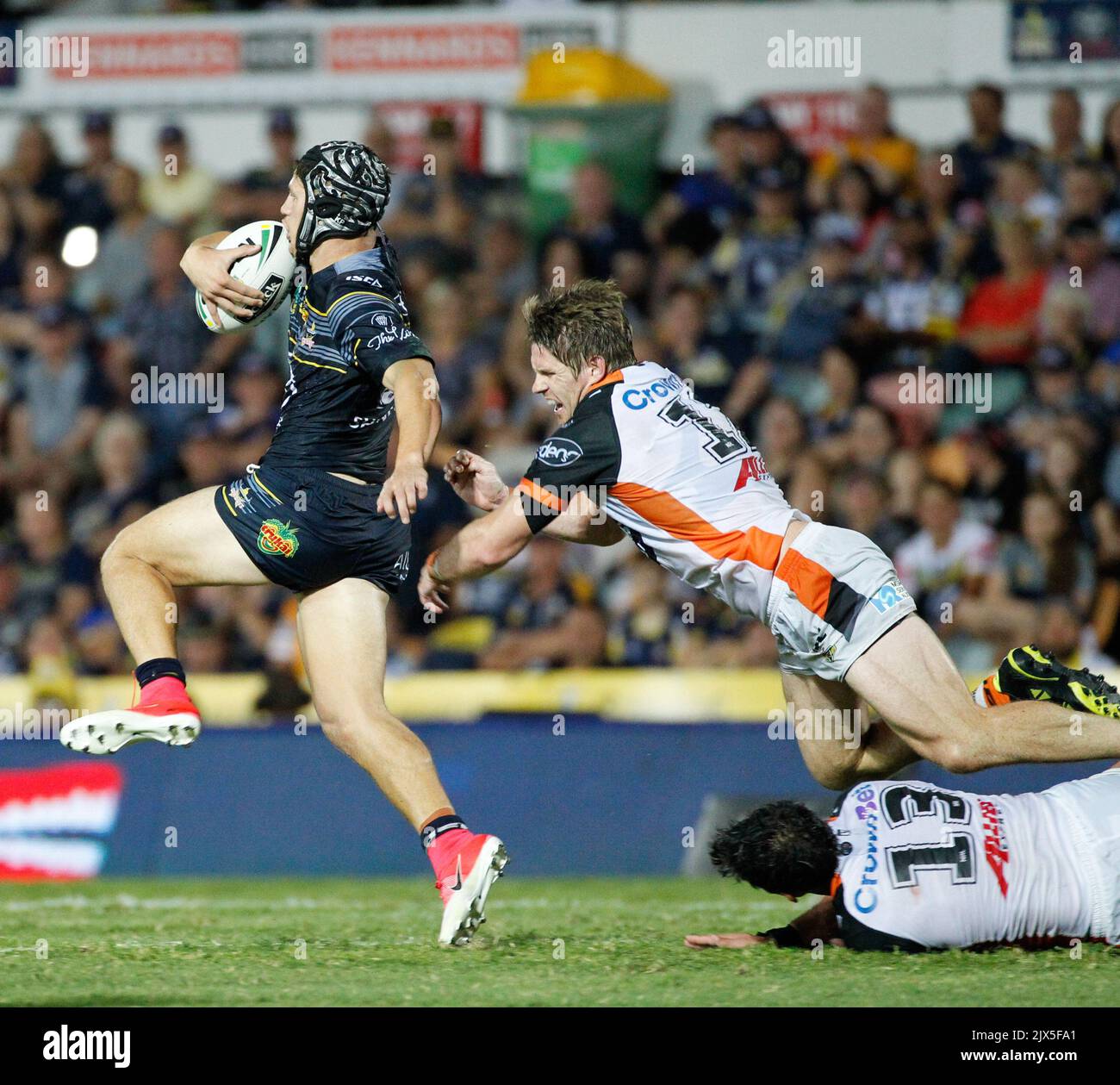 Cowboys Kalyn Ponga makes a break from the Tigers defence during the ...